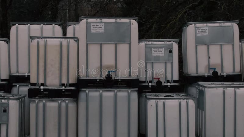 Stack of Intermediate Bulk Containers Outdoors Stock Video - Video of ...
