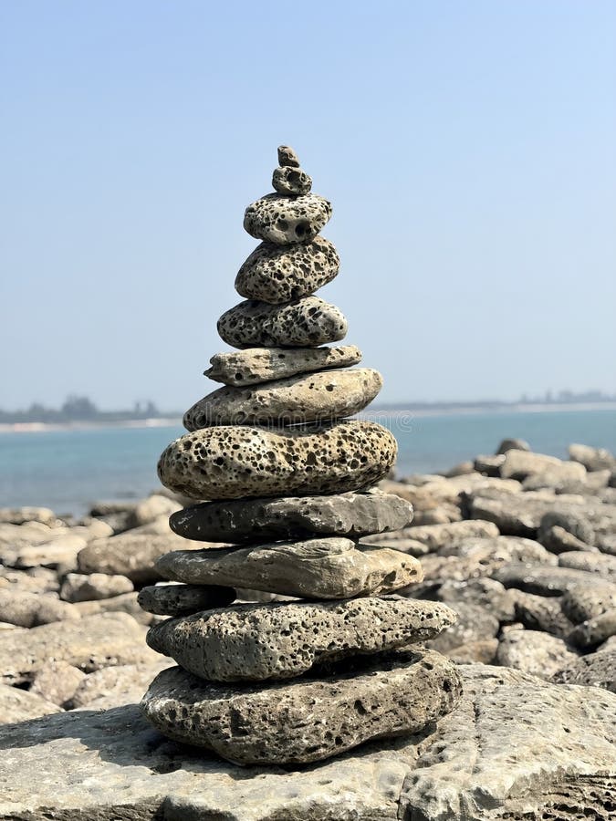 Balanced Stones Form a Tranquil Stack by the Ocean. Stock Photo - Image ...