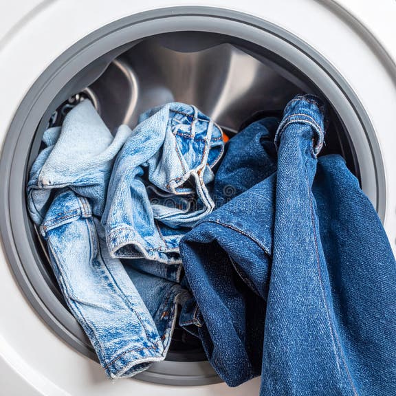 Dirty Jeans in Washing Machine and Other Jeans Clothes Closed. Stock ...
