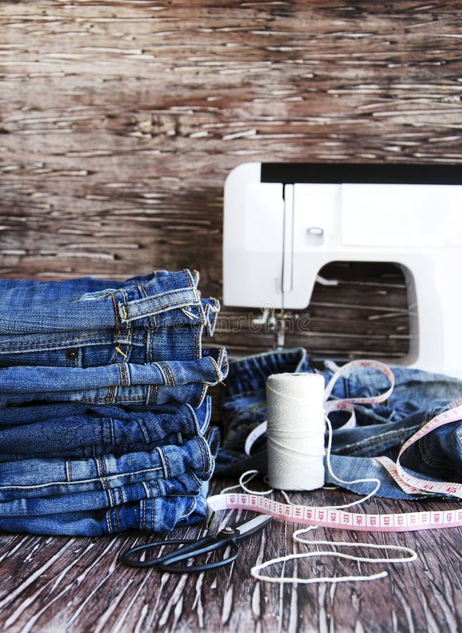 Stack of Jeans Lying on a Wooden Table Stock Photo - Image of cloth ...