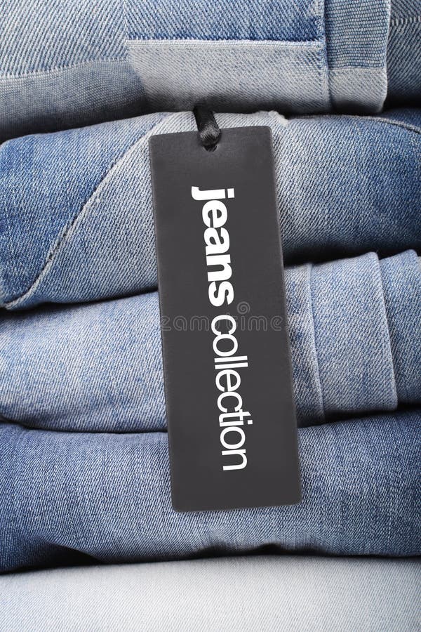 Stack of jeans with tag stock image. Image of store, wear - 31575975