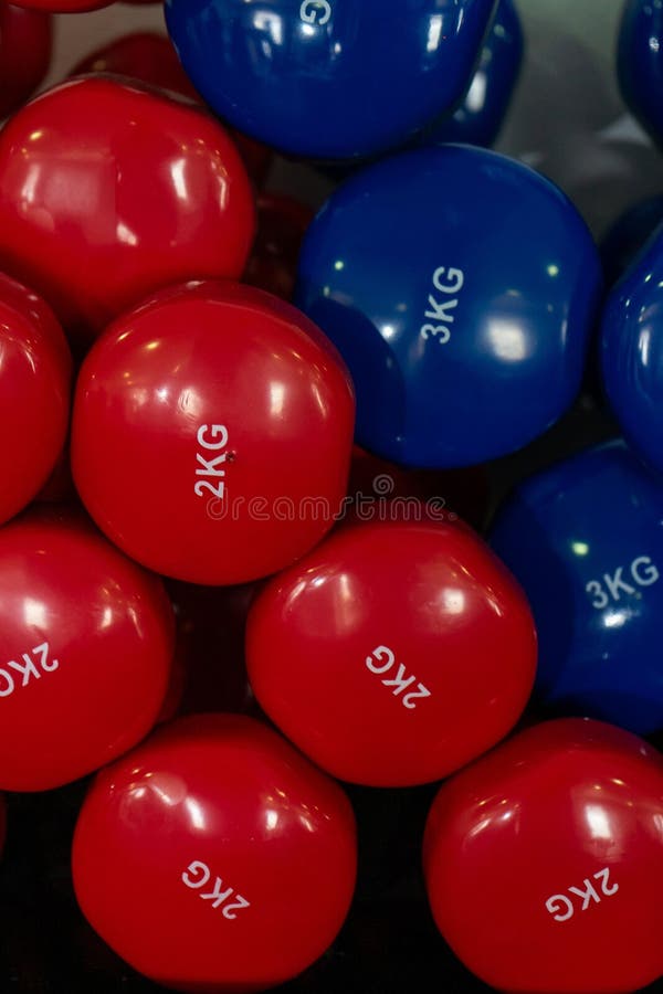 Stack of 3 and 4-kilogram Fitness Weights, Symbolizing Strength and ...