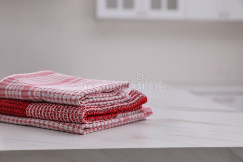 Stack of Kitchen Towels on White Marble Table. Space for Text Stock ...