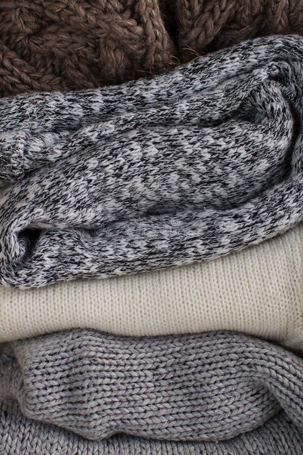 A Stack of Knitted Clothes of Different Colors and Textures Stock Photo ...