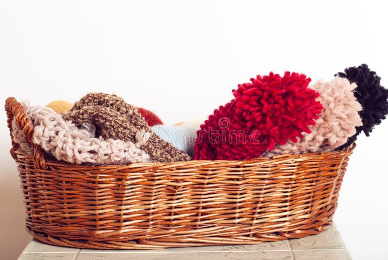 Stack of Knitted Hats and Yarns in a Basket Stock Image - Image of ...