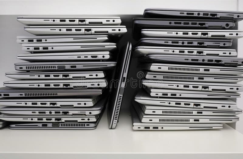Stack of Laptops in the Storage Room of a Company Stock Photo - Image ...