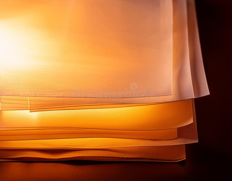 A Stack of Layered Vellum Papers Glowing Softly Under a Warm Amber ...