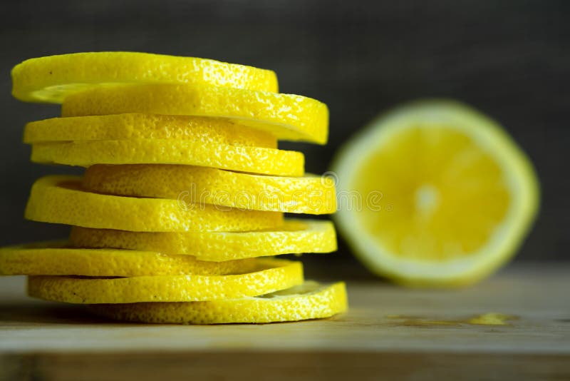 A Stack of Lemon Slices on a Wooden Board Stock Image - Image of fresh ...