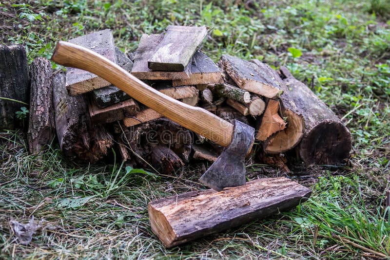 Stack of logs with axe stock photo. Image of instrument - 96009934
