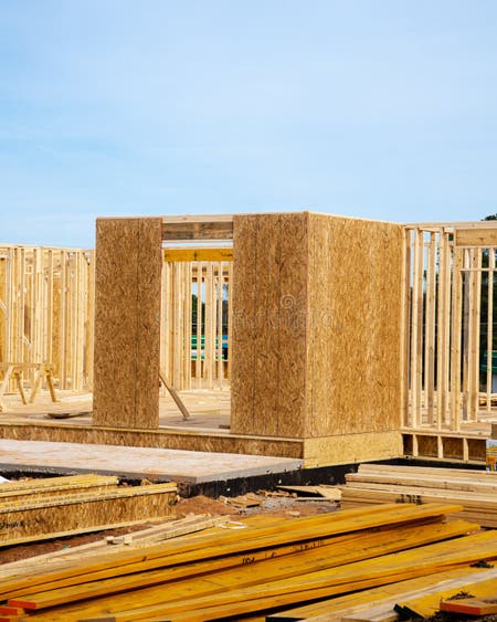 Stack of Lumbers in Front of Timber Frame House with Post, Beam, OSB ...