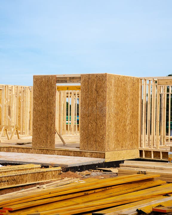 Stack of Lumbers in Front of Timber Frame House with Post, Beam, OSB ...