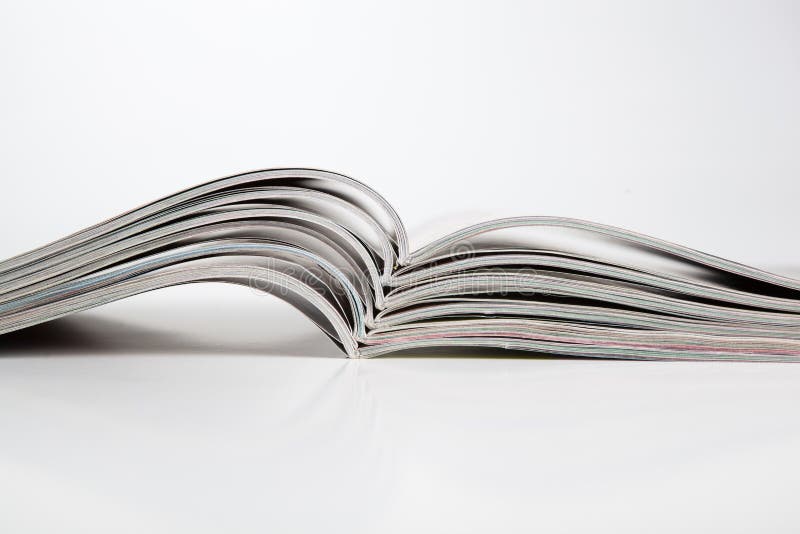 Stack of Magazines on the Table Stock Image - Image of hand, reading ...