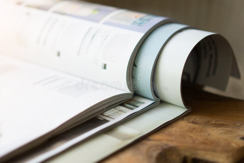 Stack of Magazines on Table Living Room Stock Photo - Image of gold ...