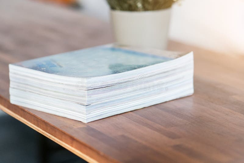 Stack of Magazines on Table Living Room Stock Photo - Image of article ...