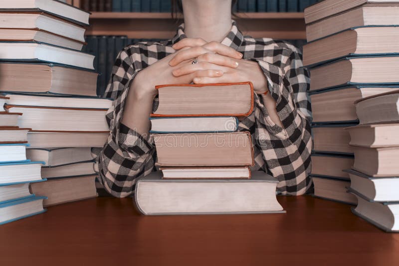 A Stack of Many Books Front Person Stock Image - Image of concept, dark ...