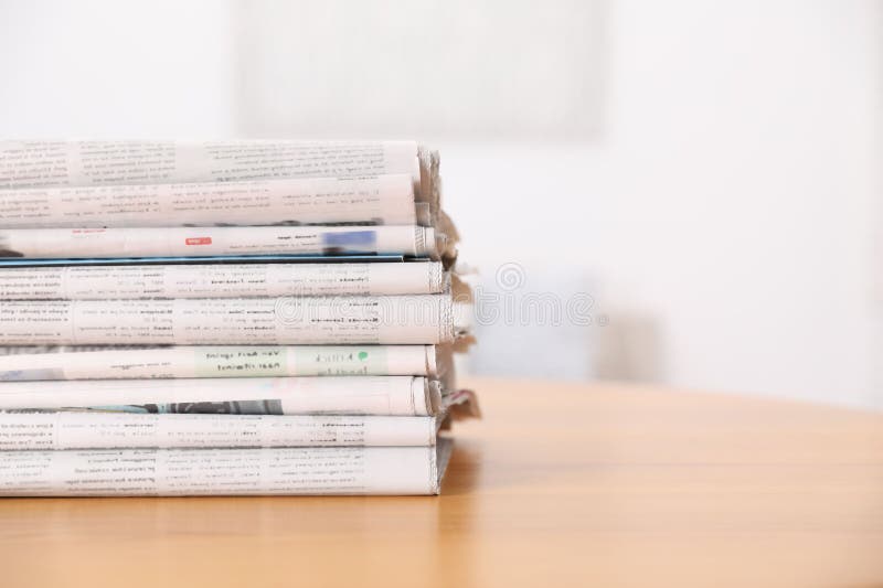 Stack of Many Newspapers in Different Languages on Wooden Table, Space ...