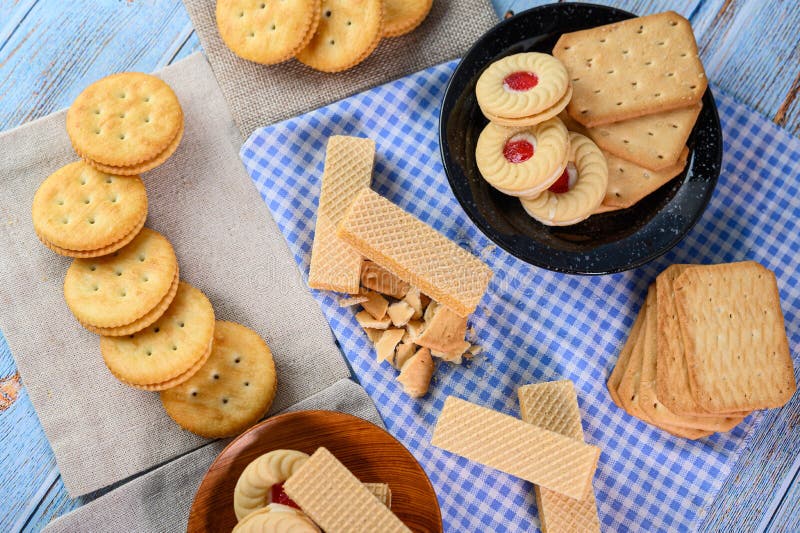 Stack Many Types of Cookies on a Plate and Put on a Wooden Table Stock ...