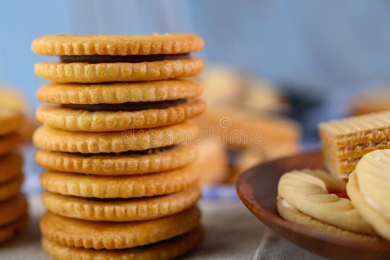 Stack Many Types of Cookies on a Plate and Put on a Wooden Table Stock ...