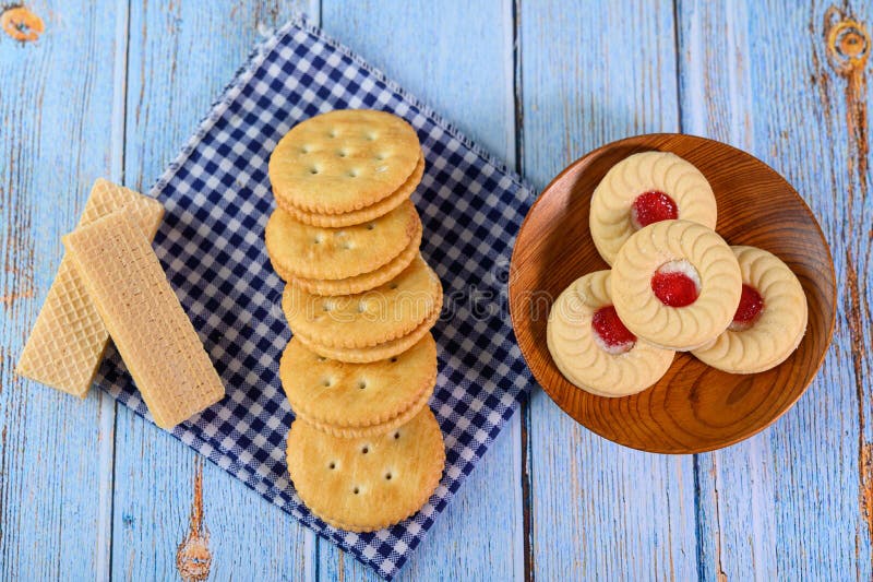 Stack Many Types of Cookies on a Plate and Put on a Wooden Table Stock ...