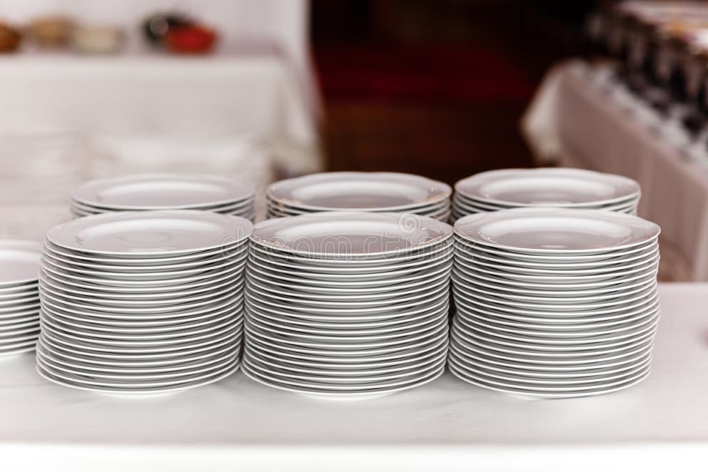 Stack of Many White Plates on the Table To Prepare for Catering Buffet ...