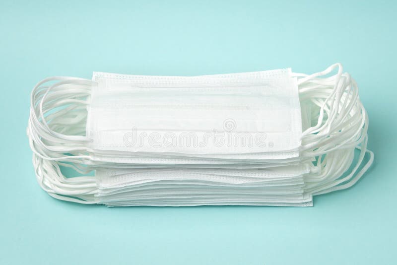 Stack of Medical Masks on the Blue Background Stock Photo - Image of ...