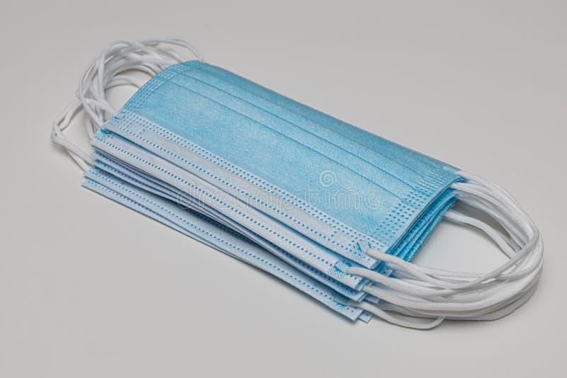 Stack of Medical Protective Masks on White Background Stock Photo ...