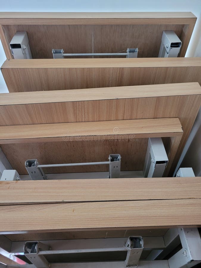 A Stack of Meeting Tables in a Storage Warehouse Stock Photo - Image of ...