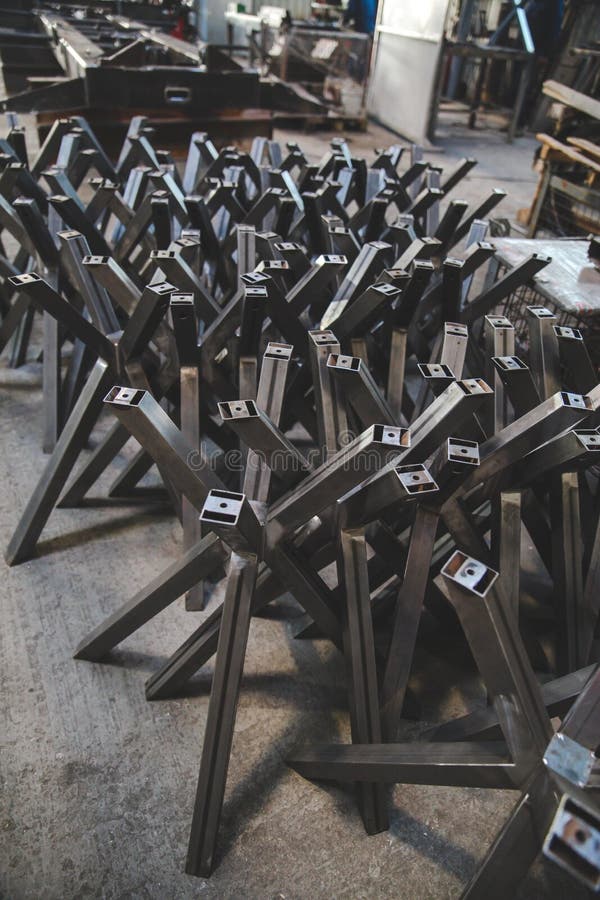 Stack of Metal Table Stands in a Factory Stock Photo - Image of ...