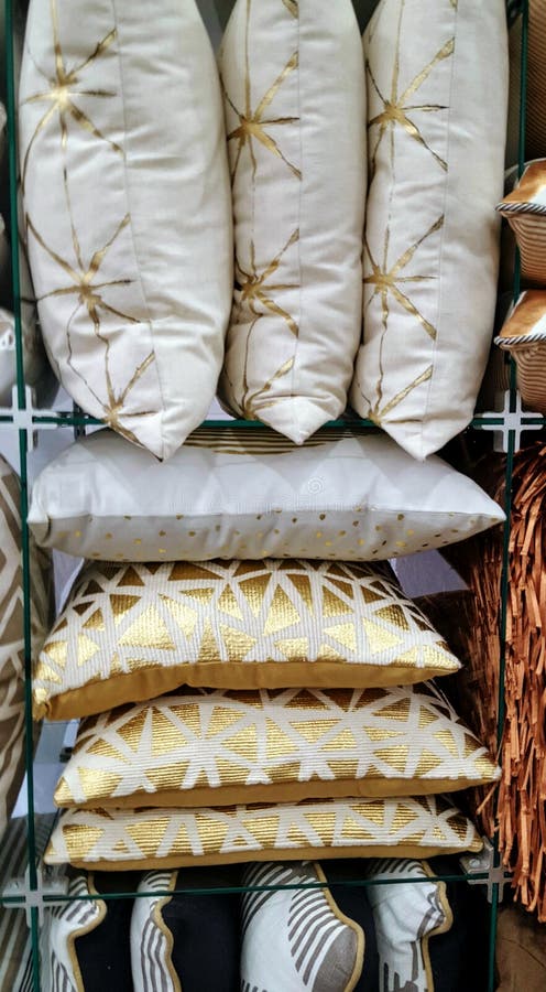 Stack of Metalic Coloured Cushions. Retail. Stock Image - Image of ...