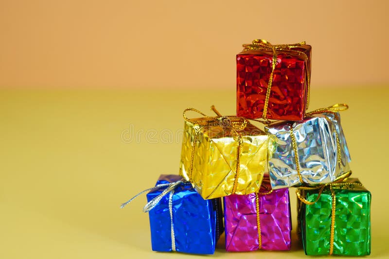 Stack of Metallic Colorful Presents with Gold Strings Isolated Stock ...