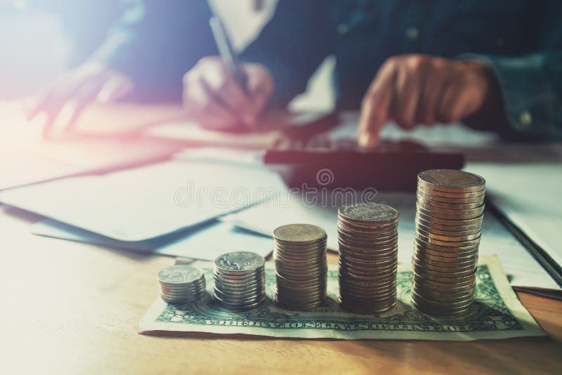 Stack Money with Blur Accountant Working in Office. Concept Saving ...