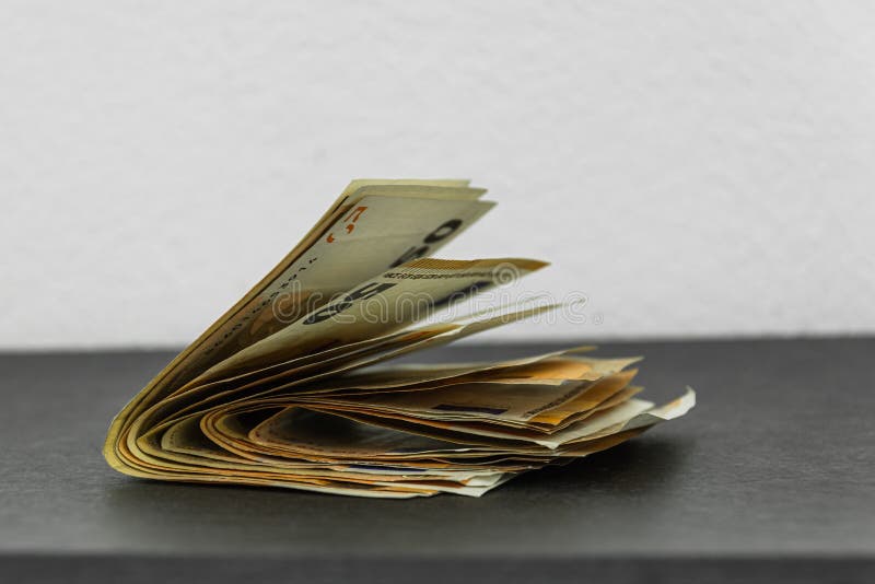 Stack of Money Folded Together on a Table Stock Image - Image of ...