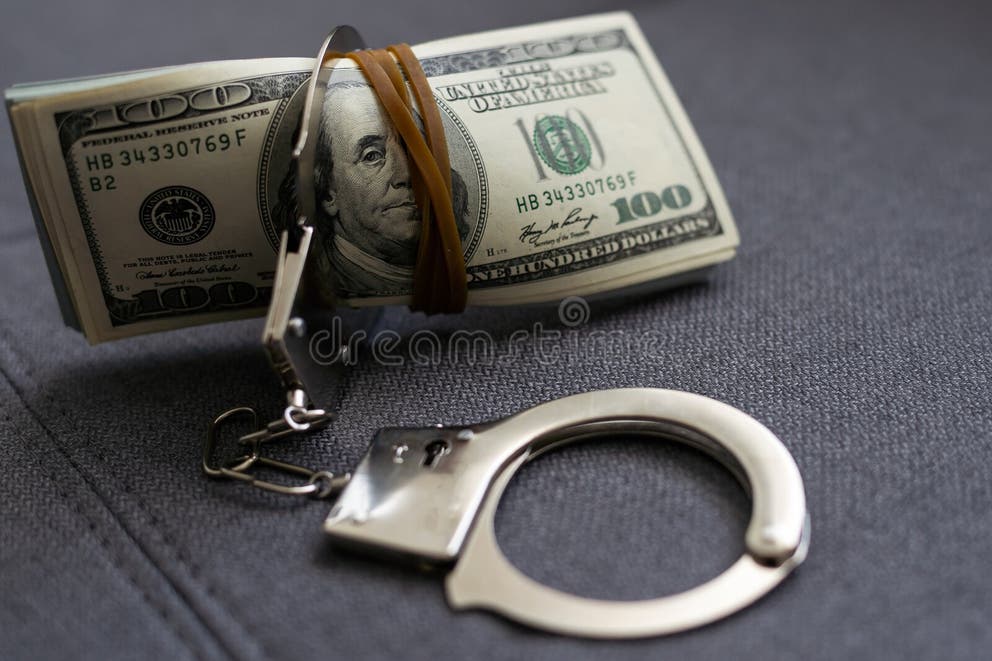 Stack of Money and Handcuffs on Table. High Quality Photo Stock Image ...