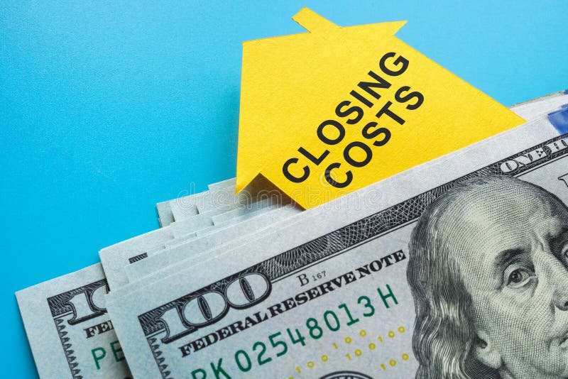 A Stack of Money and a Paper House with an Inscription Closing Costs ...