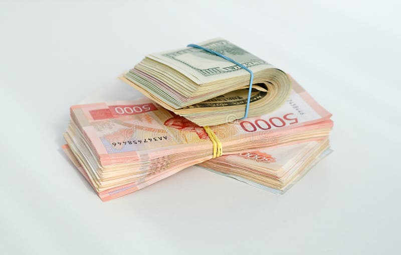 A Stack of Money with a Yellow and Blue Bill on Top. Stock Image ...