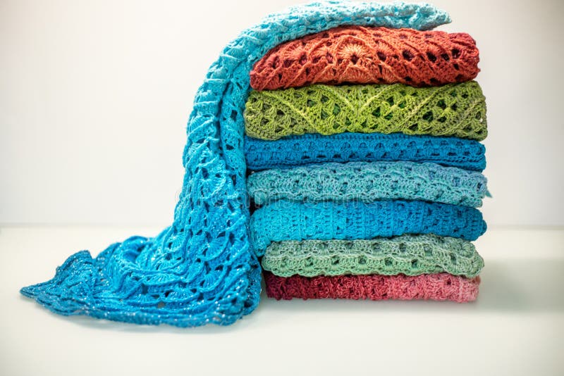 A Stack of Multi-colored Knitted Things on a White Background Stock ...