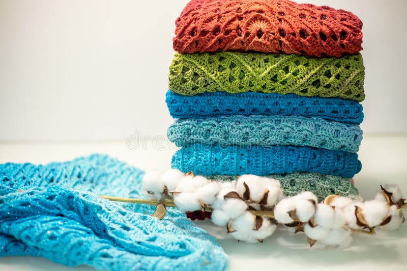 A Stack of Multi-colored Knitted Things on a White Background Stock ...