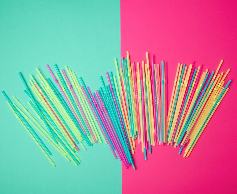 Stack of Multi-colored Plastic Tubes for a Cocktail on a Multi-colored ...