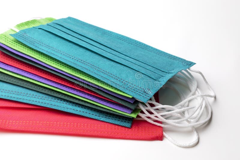 Stack of Multi-colored Protective Masks on White Background ...