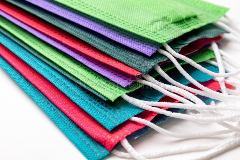 A Stack of Multi-colored Protective Masks on a White Background ...