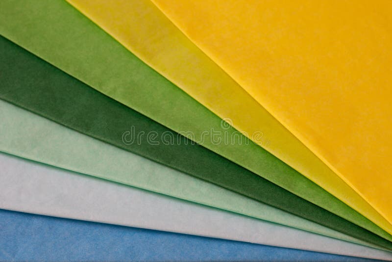 A Stack of Multi Colored Tissue Paper Spread Out in a Fan Stock Photo ...