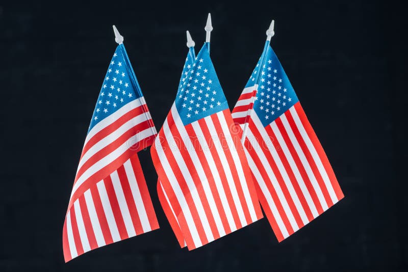 Stack of National American Flags Isolated on Black. Stock Photo - Image ...