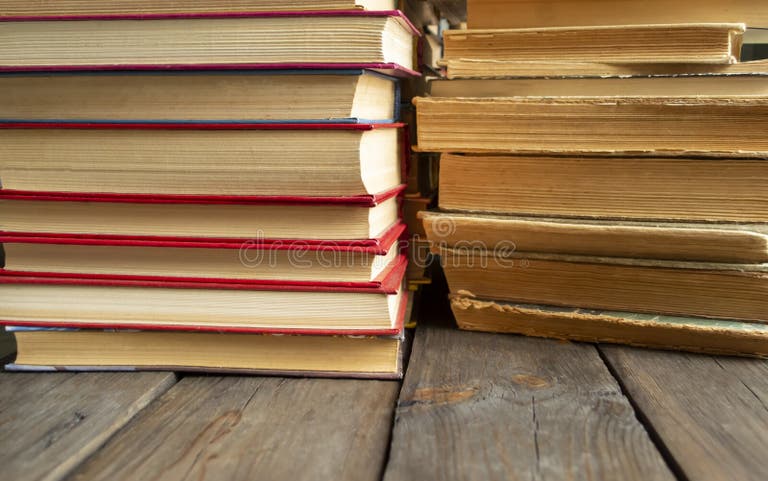 A Stack of New Books Next To Old Ones. Books of Different Generations ...