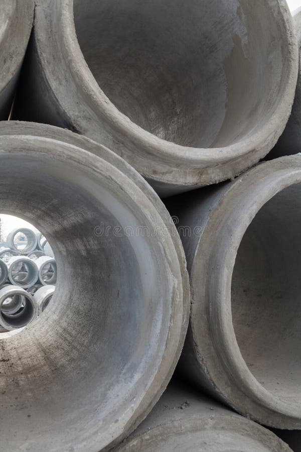 Stack of New Concrete Pipes Stock Photo - Image of manufacturing, canal ...