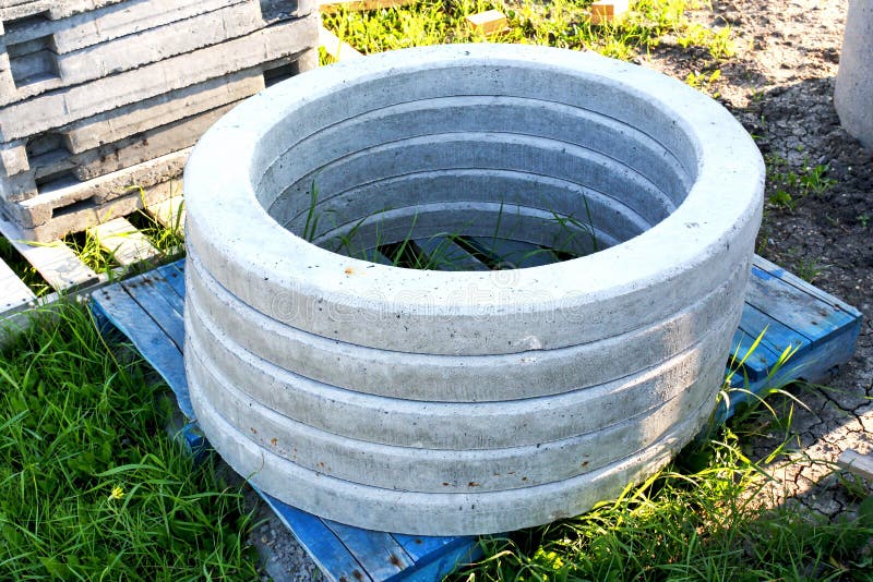 A Stack of New Concrete Rings Stock Photo - Image of drain ...