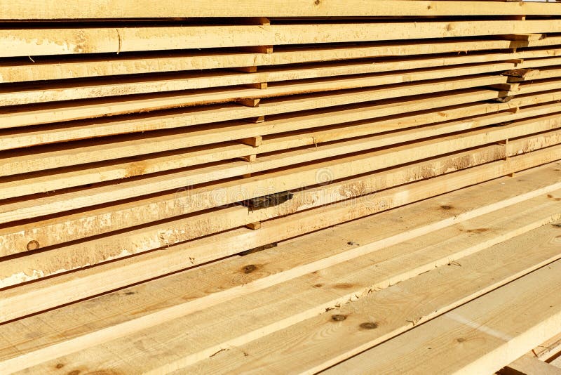 Stack of New Wooden Studs at the Lumber Yard. Timber on the ...