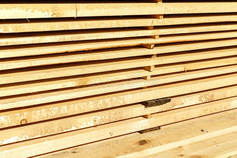 Stack of New Wooden Studs at the Lumber Yard. Timber on the ...