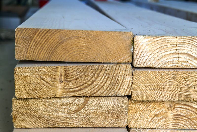 Stack of New Wooden Studs at the Lumber Yard. Wood Timber Construction ...
