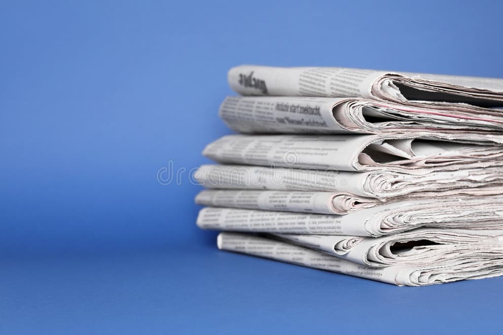 Stack of Newspapers in Different Languages on Blue Background, Space ...