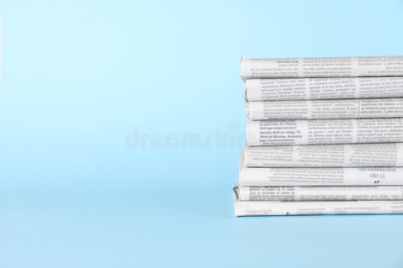 Stack of Newspapers in Different Languages on Light Blue Background, Space for Text Stock Image ...